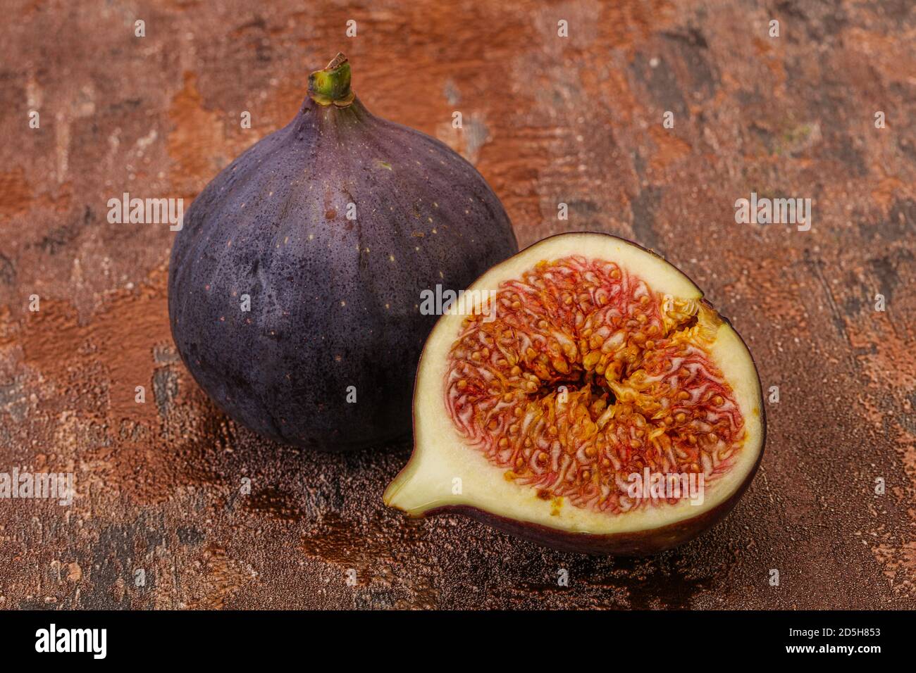 Sweet purple slice of fig fruit Stock Photo - Alamy