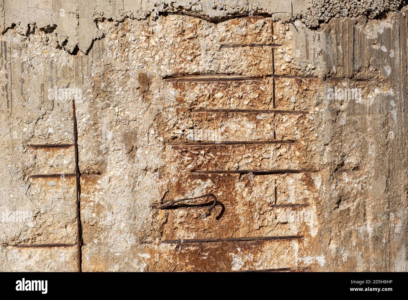 Reinforced concrete with damaged and rusty steel reinforcement. Old ...