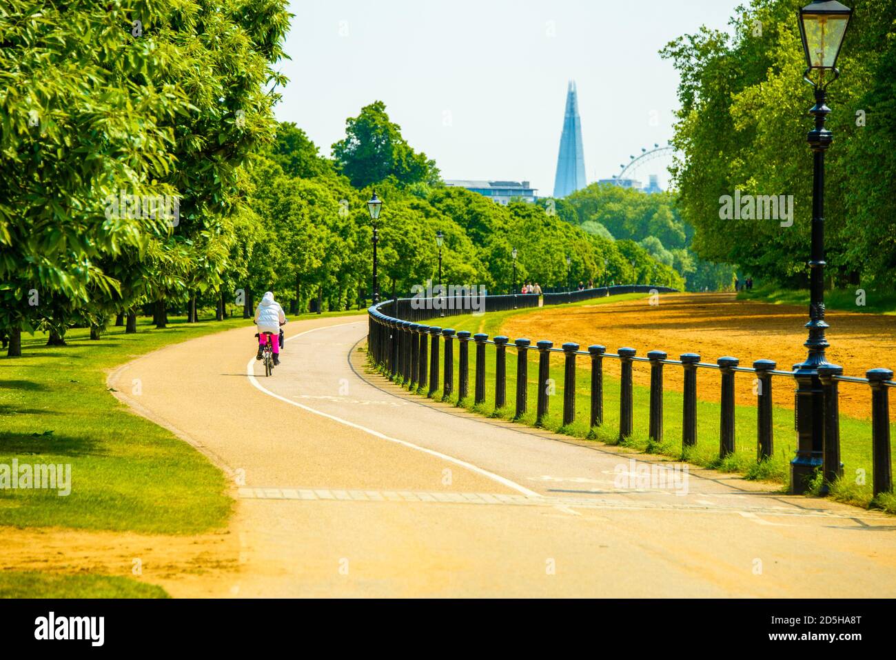 Beautiful path in Hyde Park in London with the Shard skyscraper on the ...