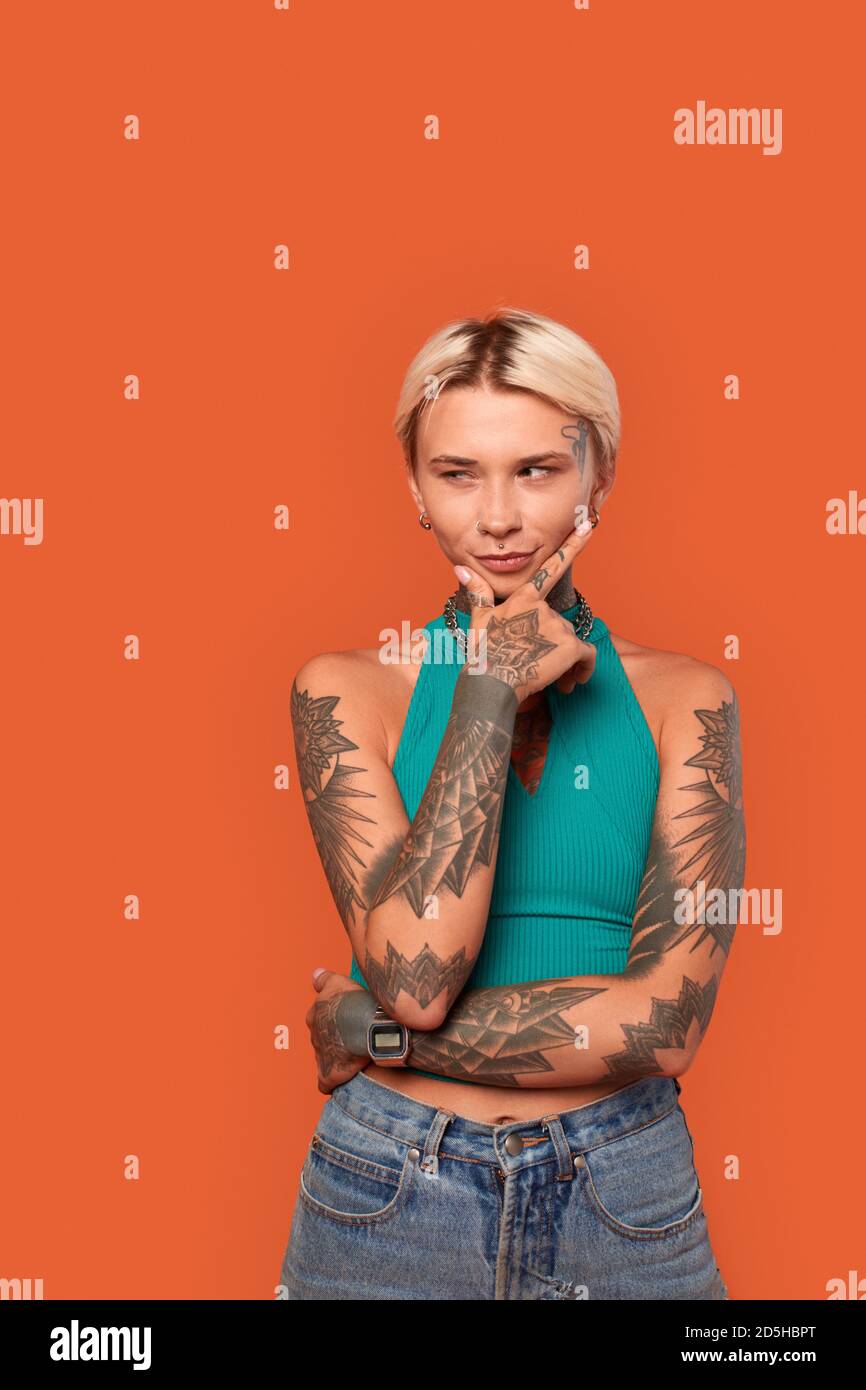 Young adult girl with ponder face looking aside Stock Photo - Alamy