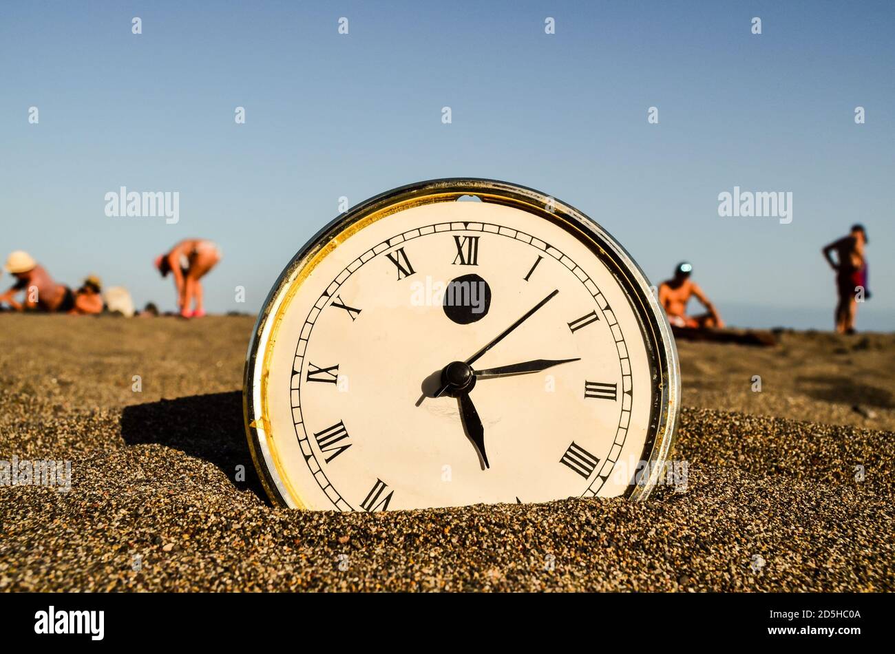 Clock on the Sand Beach Stock Photo - Alamy