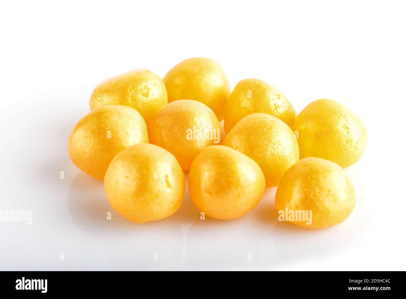 Heap of yellow hard sugar candies isolated on white background Stock ...