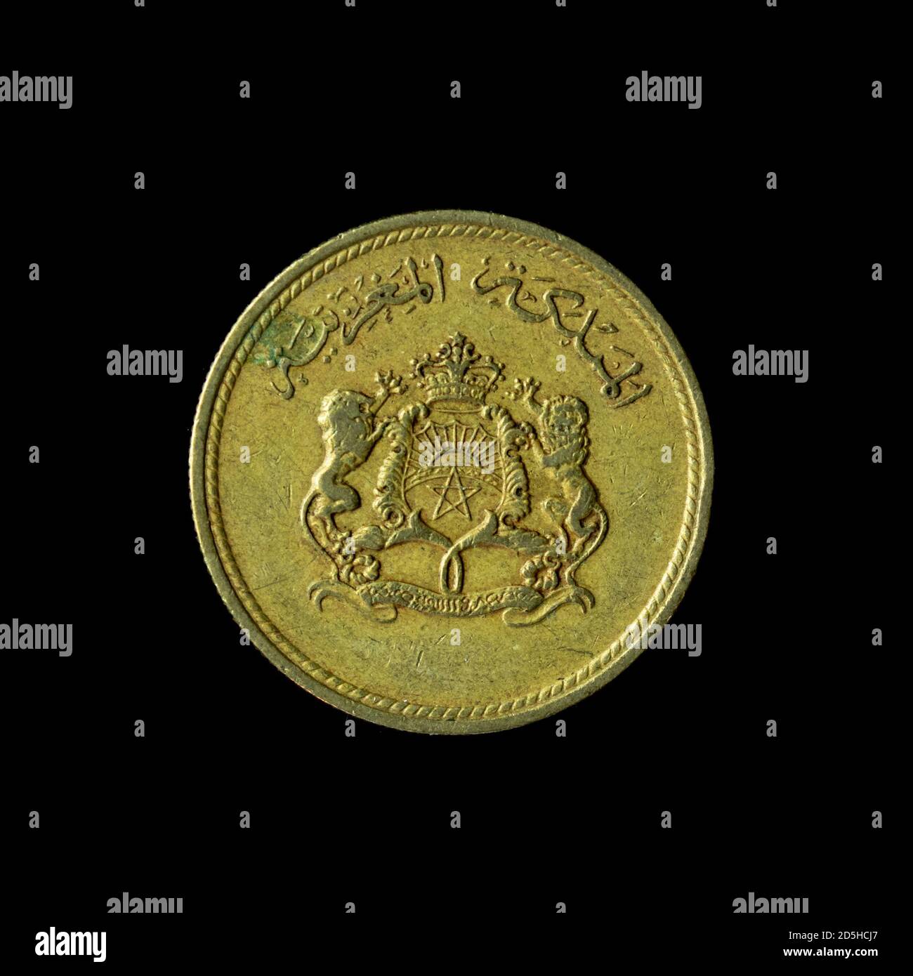 Morrocan Ten Centimes coin isolated on the black background Stock Photo ...