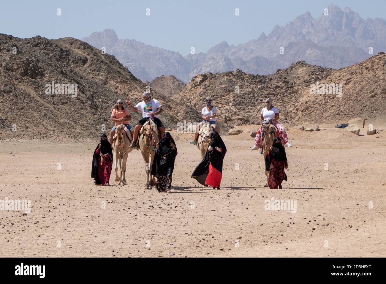 Hurghada, Egypt - October 1, 2020: Tourists enjoy the camel safari in ...