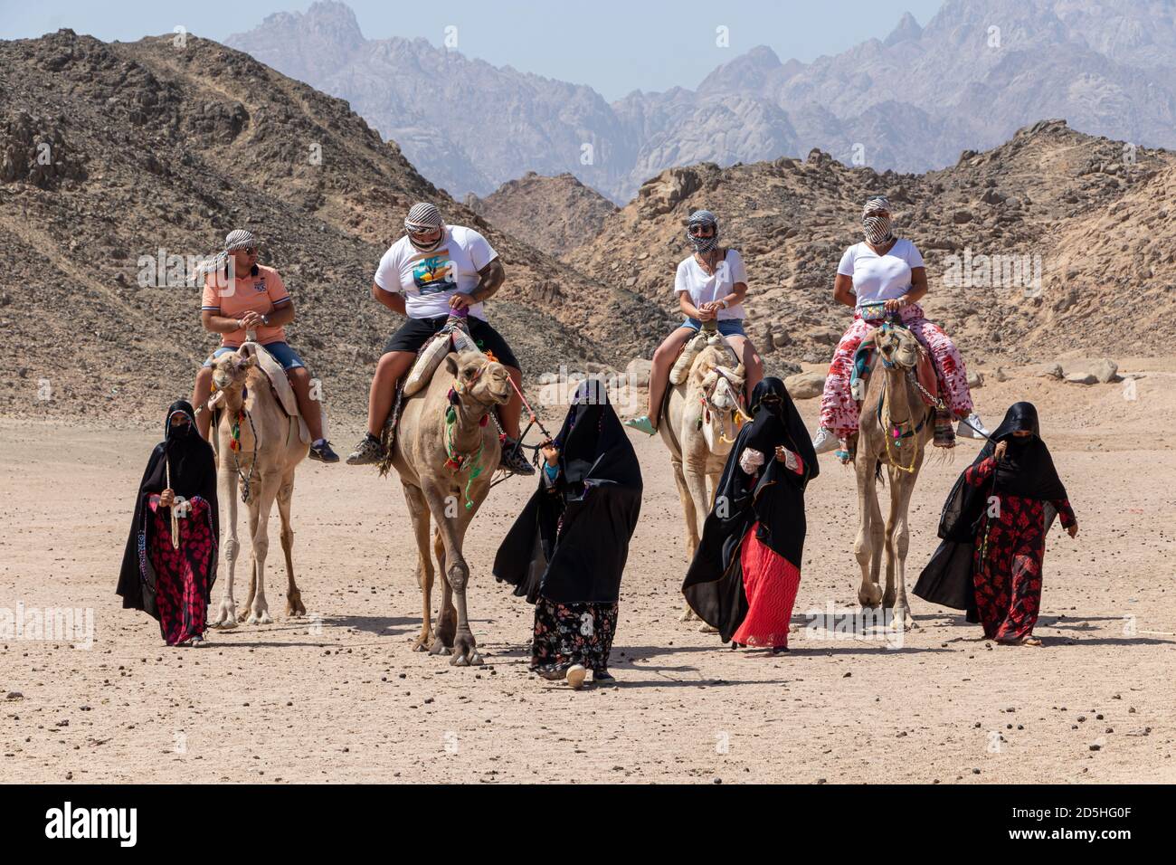 Hurghada, Egypt - October 1, 2020: Tourists enjoy the camel safari in ...