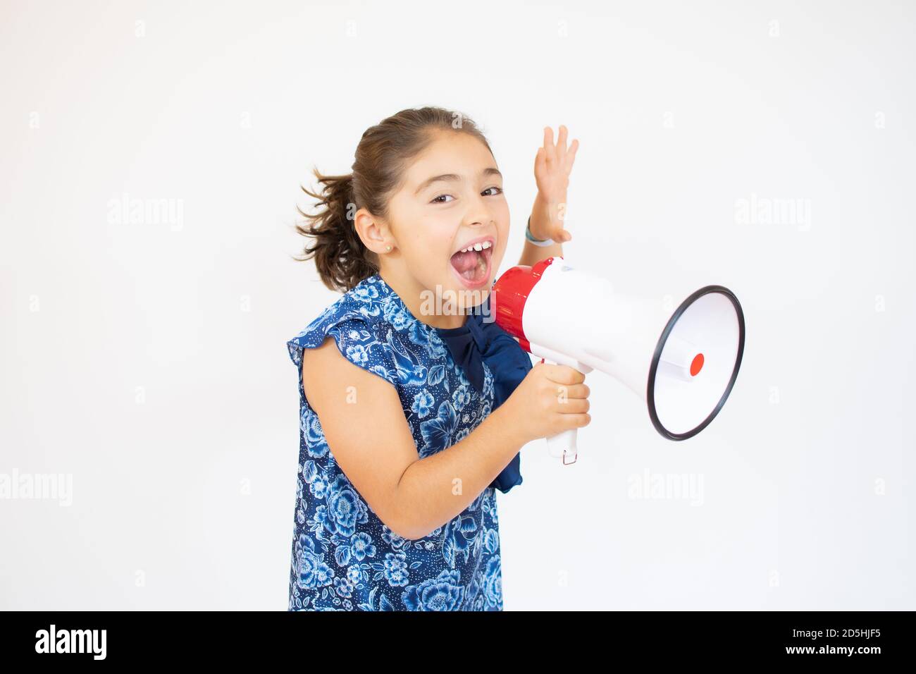 Little girl screaming and shouting with megaphone Stock Photo - Alamy