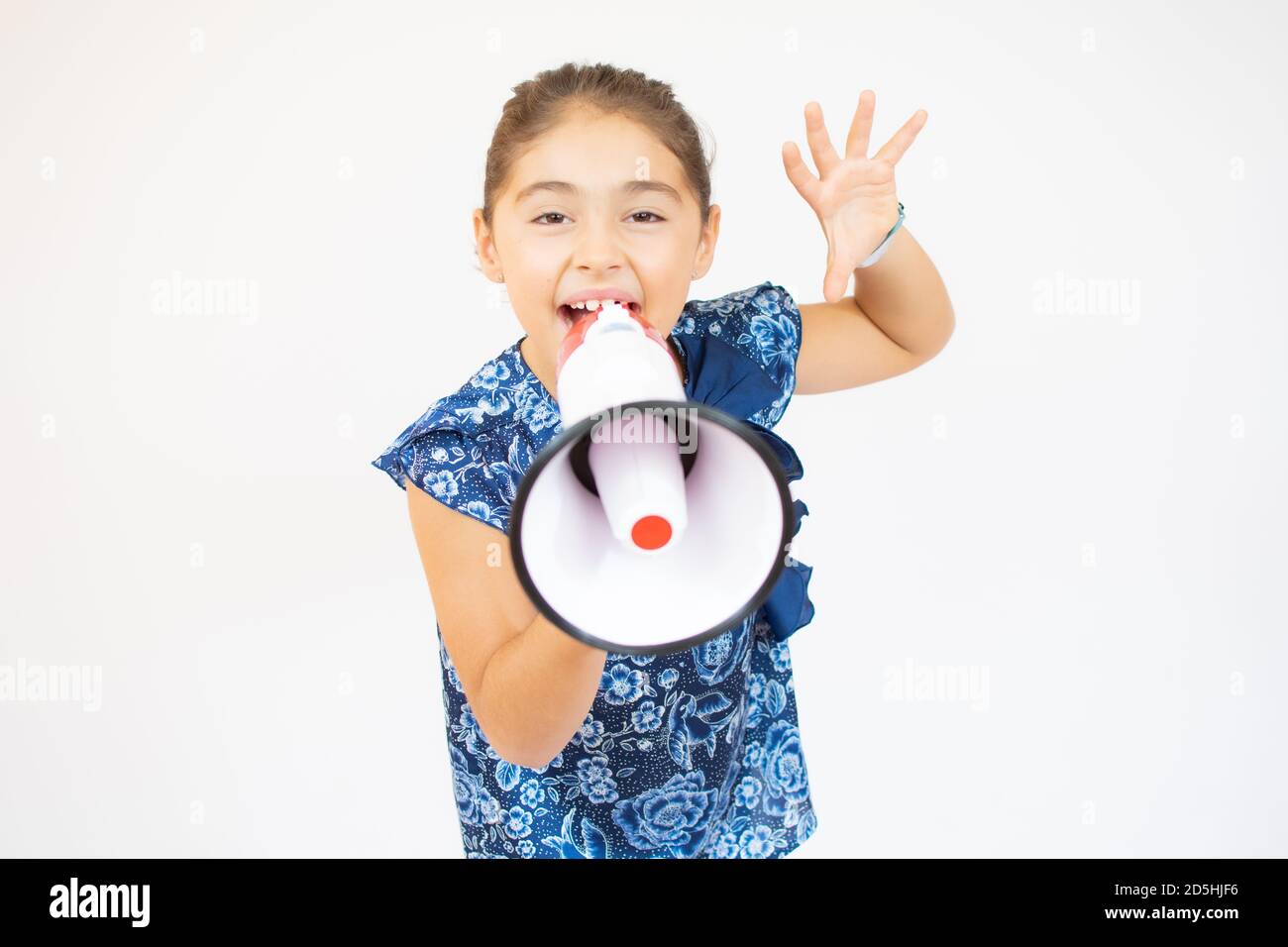 Little girl screaming and shouting with megaphone Stock Photo - Alamy