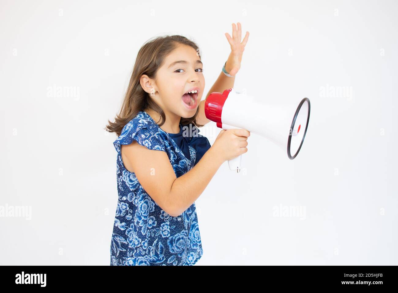Little girl screaming and shouting with megaphone Stock Photo - Alamy