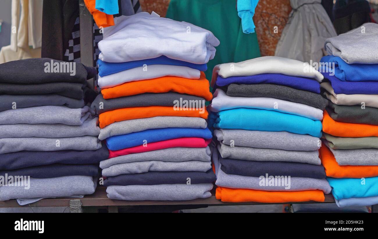Columns of stacked colorful cotton tee shirts Stock Photo - Alamy