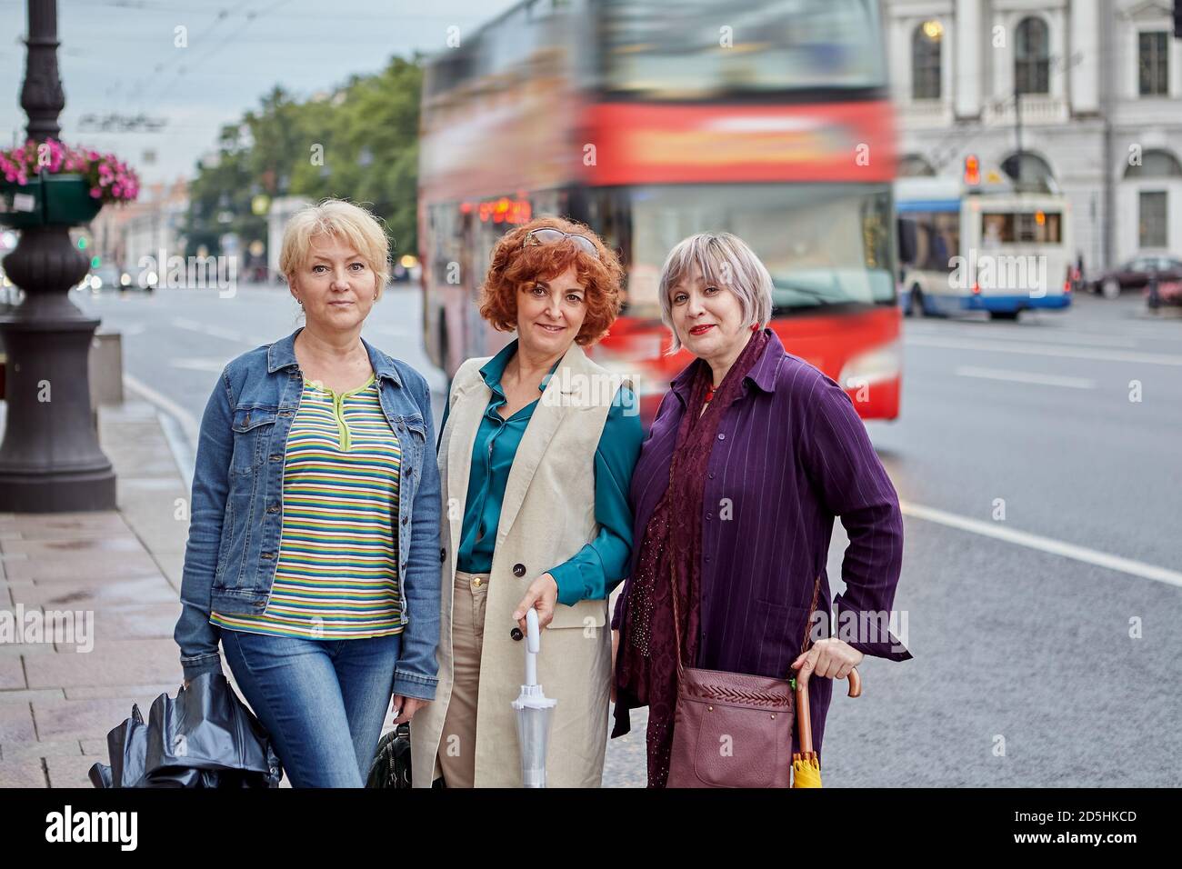 Elderly woman standing bus hi-res stock photography and images - Alamy