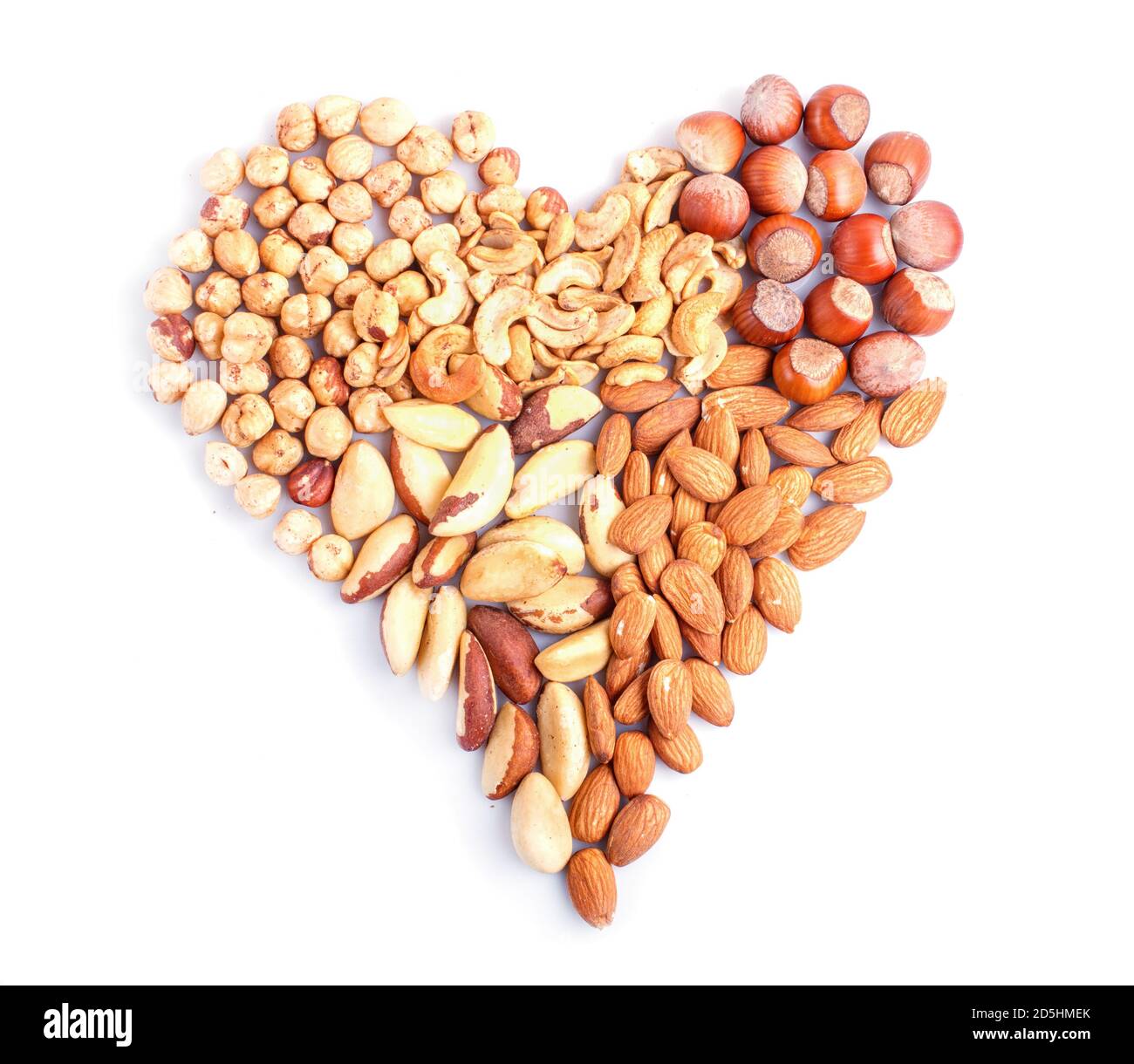 Heart made from different kinds of nuts isolated on white background ...