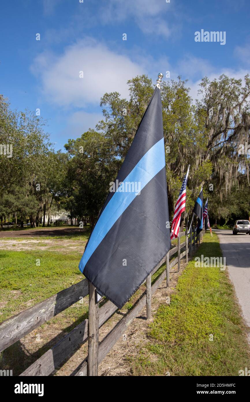 Blue Lives Matter flag aka Police Thin Blue Line flag, waving in the ...
