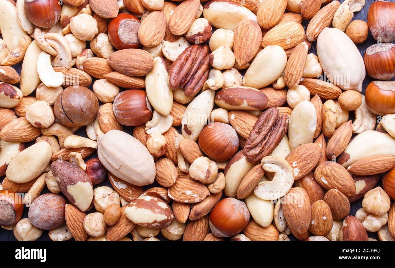Background and texture made from different kinds of nuts. hazelnut ...
