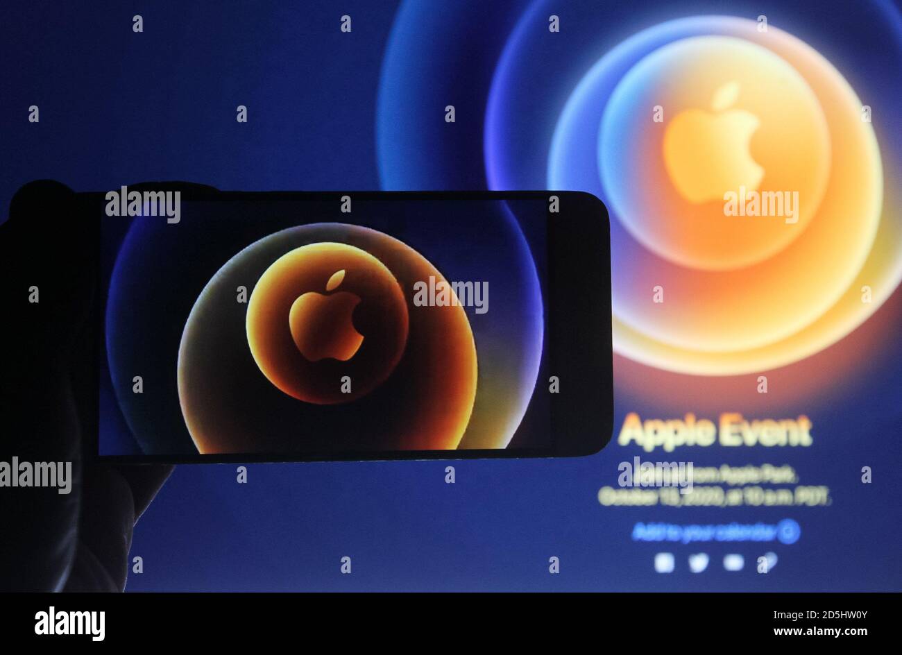 In this photo illustration the Apple logo seen displayed on a ...