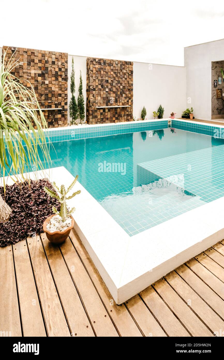 Vertical shot of a pool in a modern house Stock Photo - Alamy