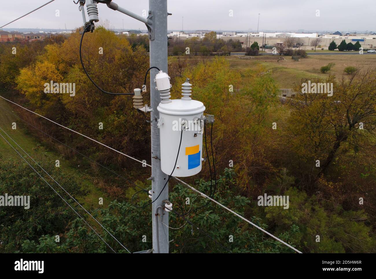 compact overhead transmission placed on electrical tower for delivery ...