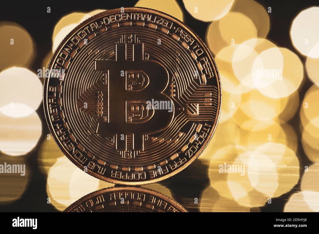 Golden bitcoin with yellow bokeh background. Cryptocurrency concept ...