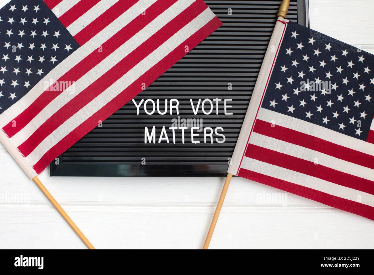 Letterboard sign with the words YOUR VOTE MATTERS with American flag ...