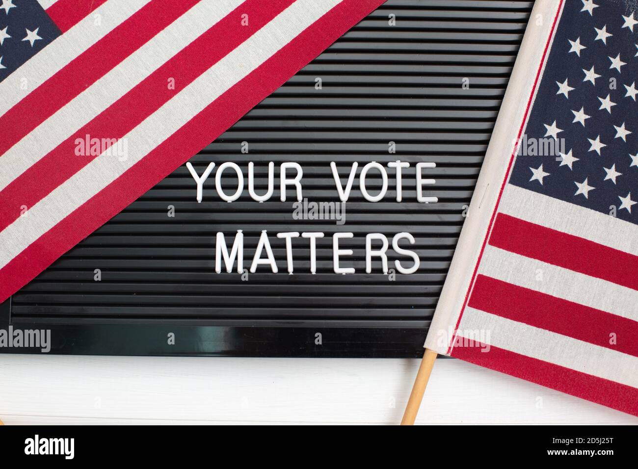 Letterboard sign with the words YOUR VOTE MATTERS with American flag ...