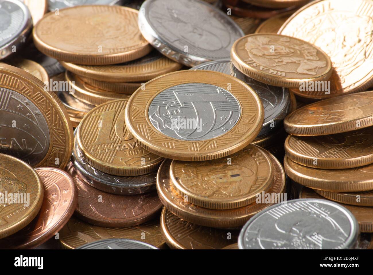 Real currency, money from Brazil. Stack with several Brazilian coins ...