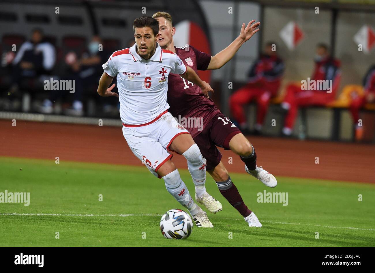 Riga, Latvia. 13th Oct, 2020. Malta's Matthew Guillaumier (L) controls ...
