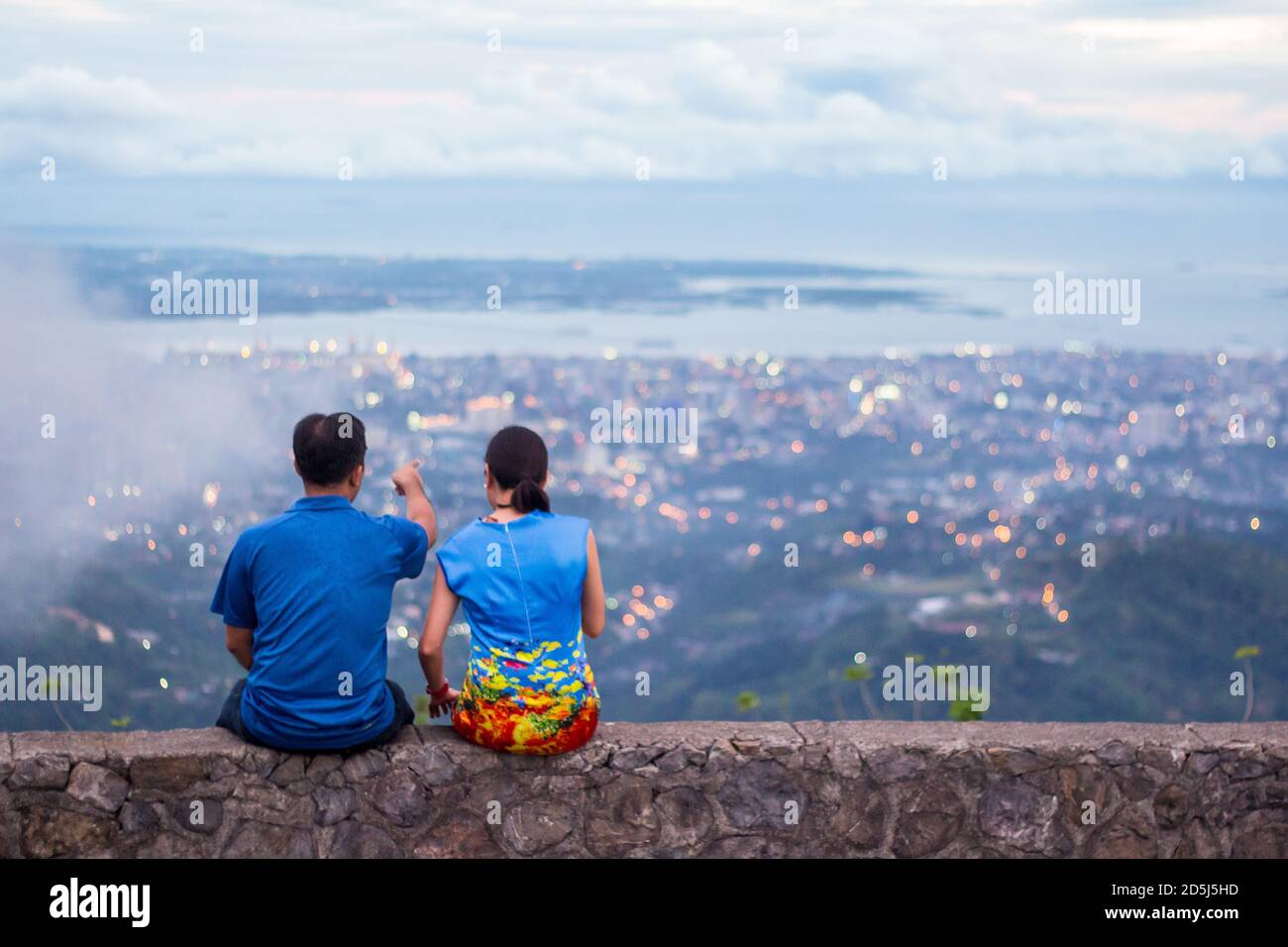 Two lovers at a view deck overlooking Cebu City Stock Photo - Alamy