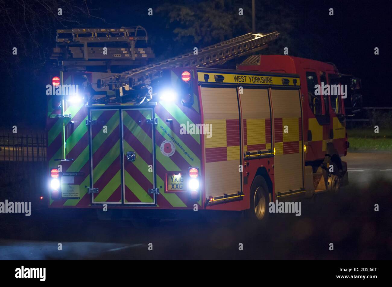 Fire engine or fire truck reversing at a emergency scene at night time ...
