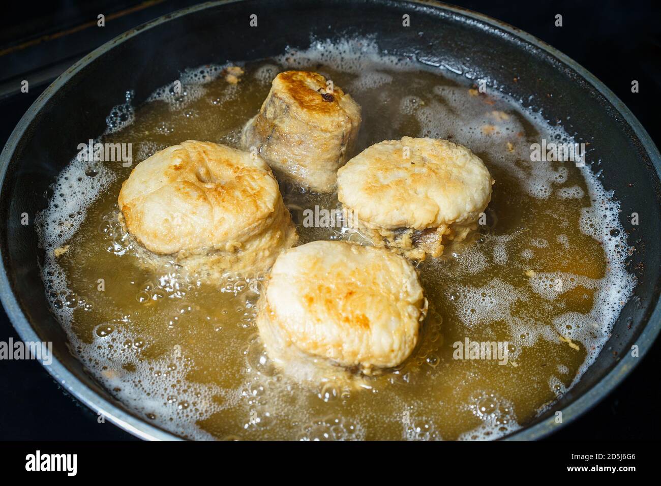 Closeup shot of fish boiling in a frying fat Stock Photo - Alamy