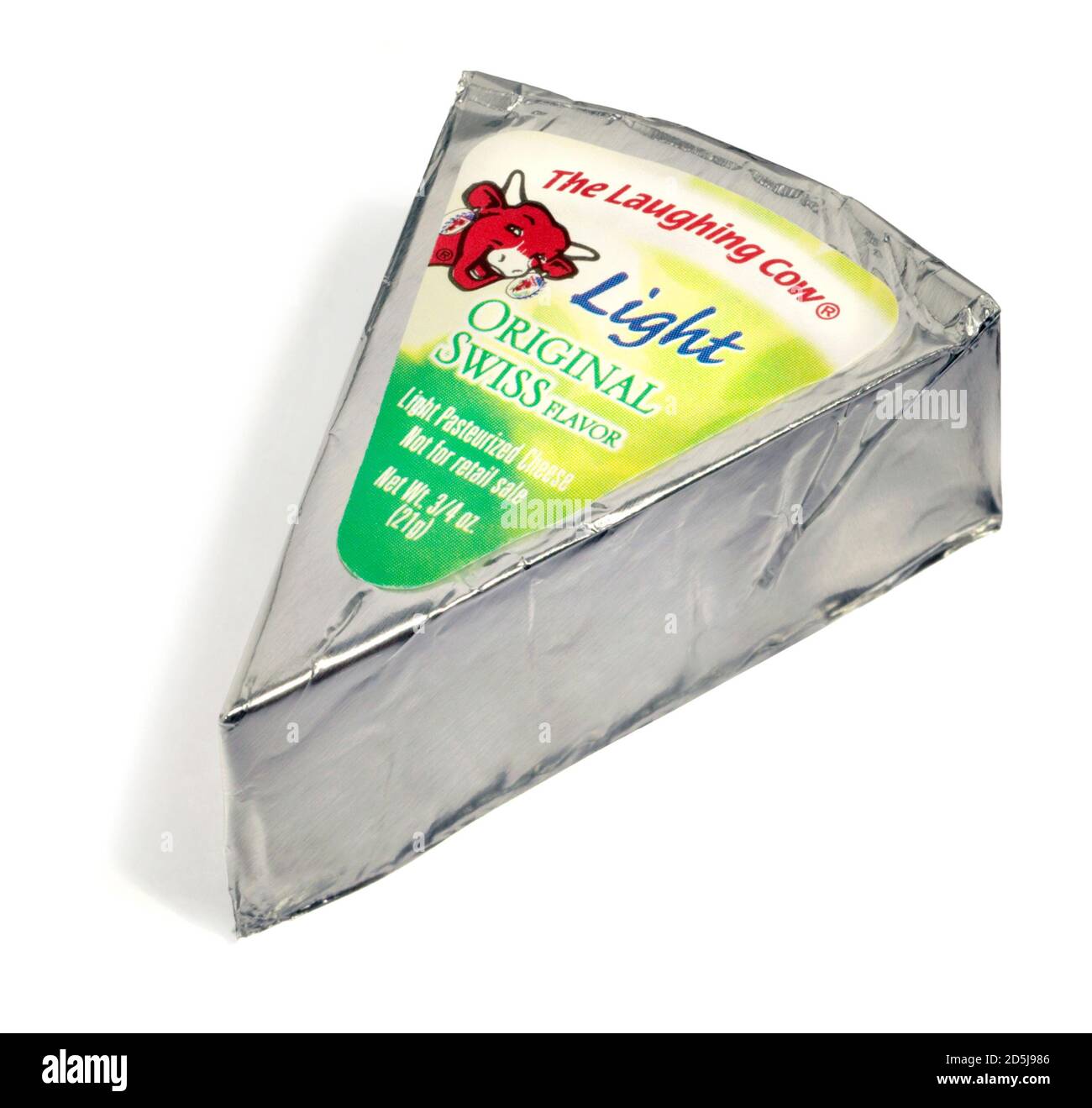 An individually wrapped Laughing Cow cheese wedge photographed on a ...