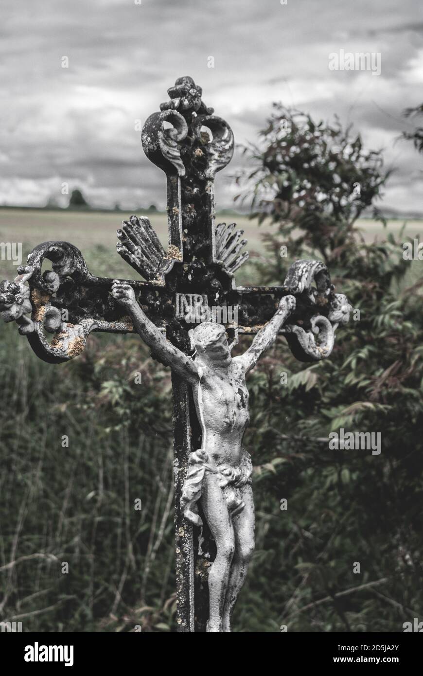 Vertical shot of a cross with attributes of Jesus Christ Stock Photo ...