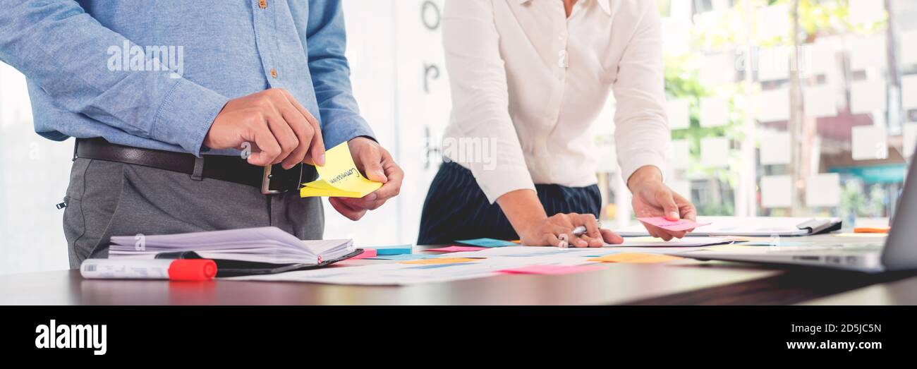 Creative group of business people brainstorming use sticky notes ...