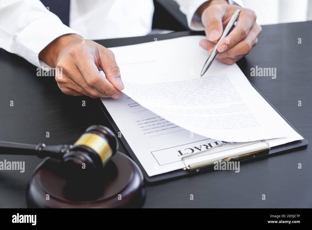 Lawyer or judge present client with contract document papers, Law and ...