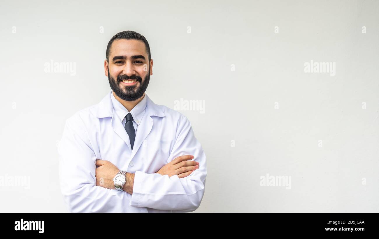 Caucasian bearded doctor happily smiling Stock Photo - Alamy