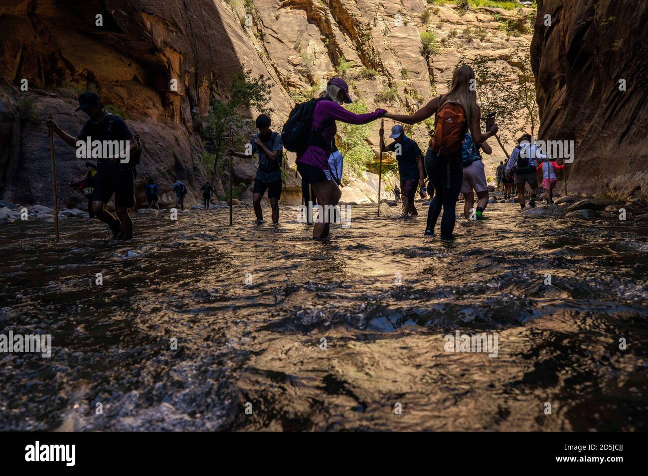 Springdale, Utah, USA. 10th Aug, 2020. Hikers wade through waters in ...