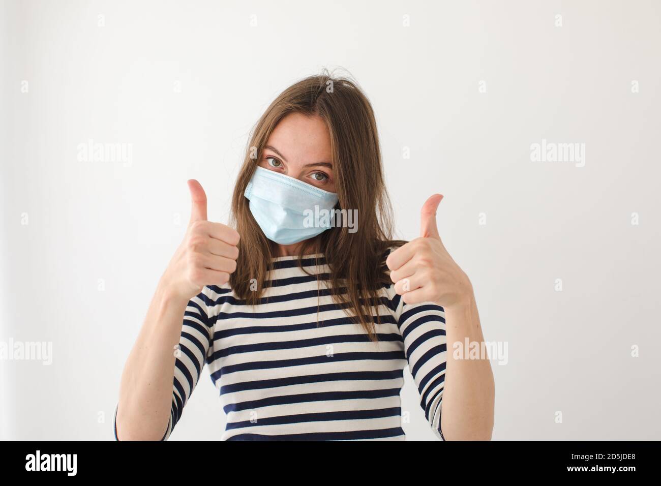 Thumb up with mask hi-res stock photography and images - Alamy