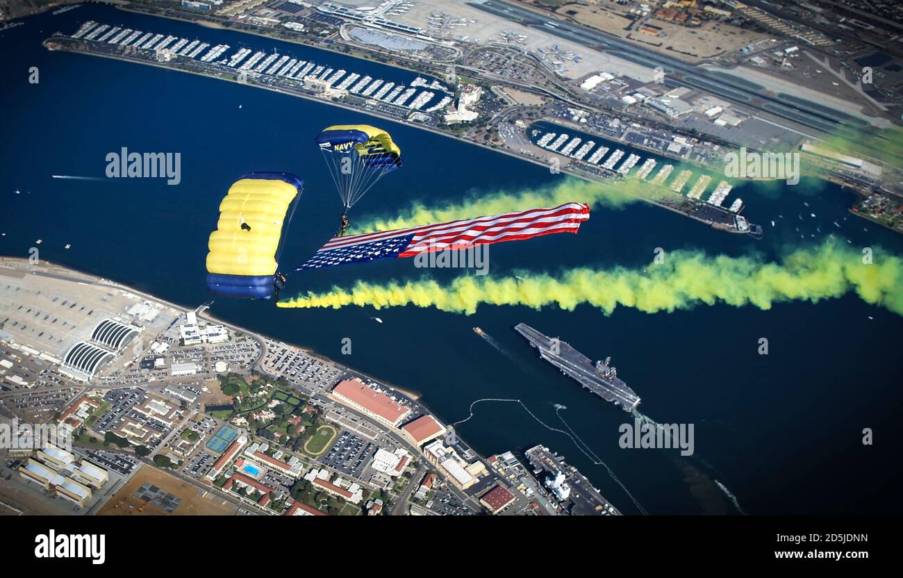 Members of the U.S. Navy Parachute Team, the Leap Frogs, conduct a ...