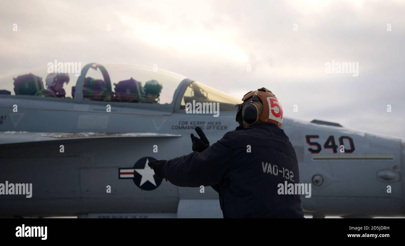 A U.S. Navy aircraft mechanic assigned to the Electronic Attack ...