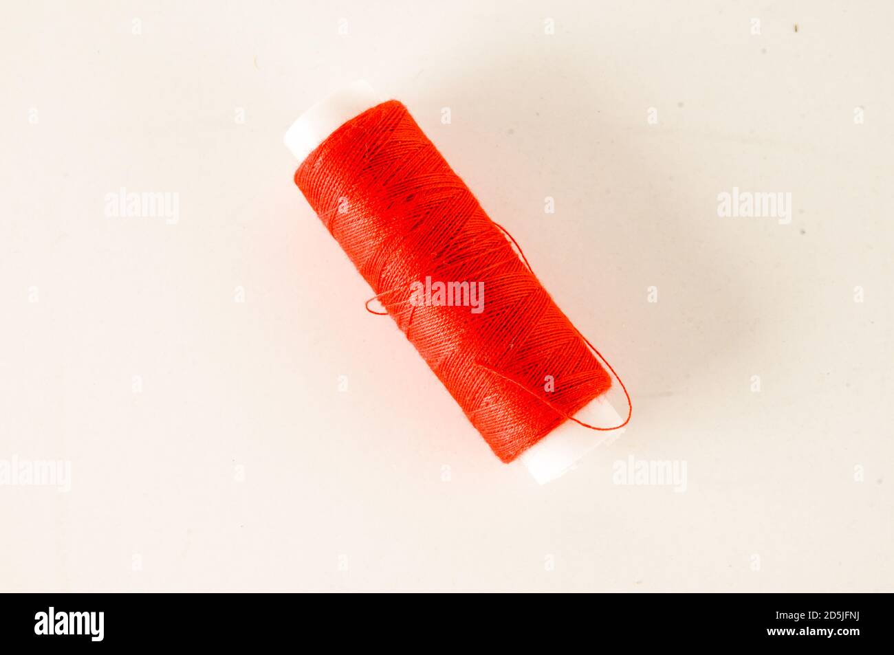 Colored sewing thread background Stock Photo - Alamy