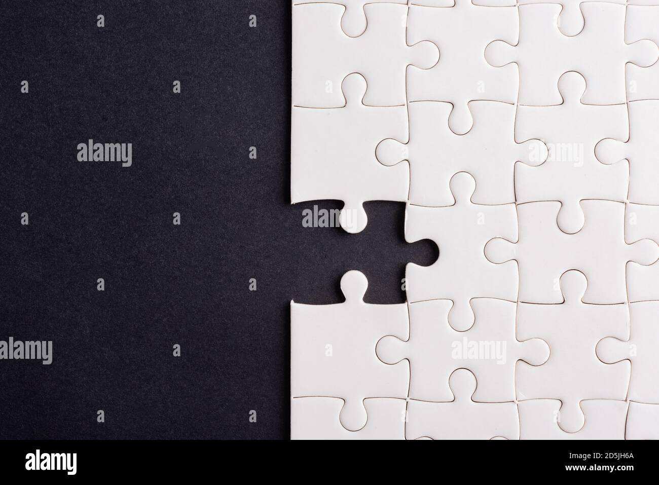 Top view flat lay of paper plain white jigsaw puzzle game texture ...