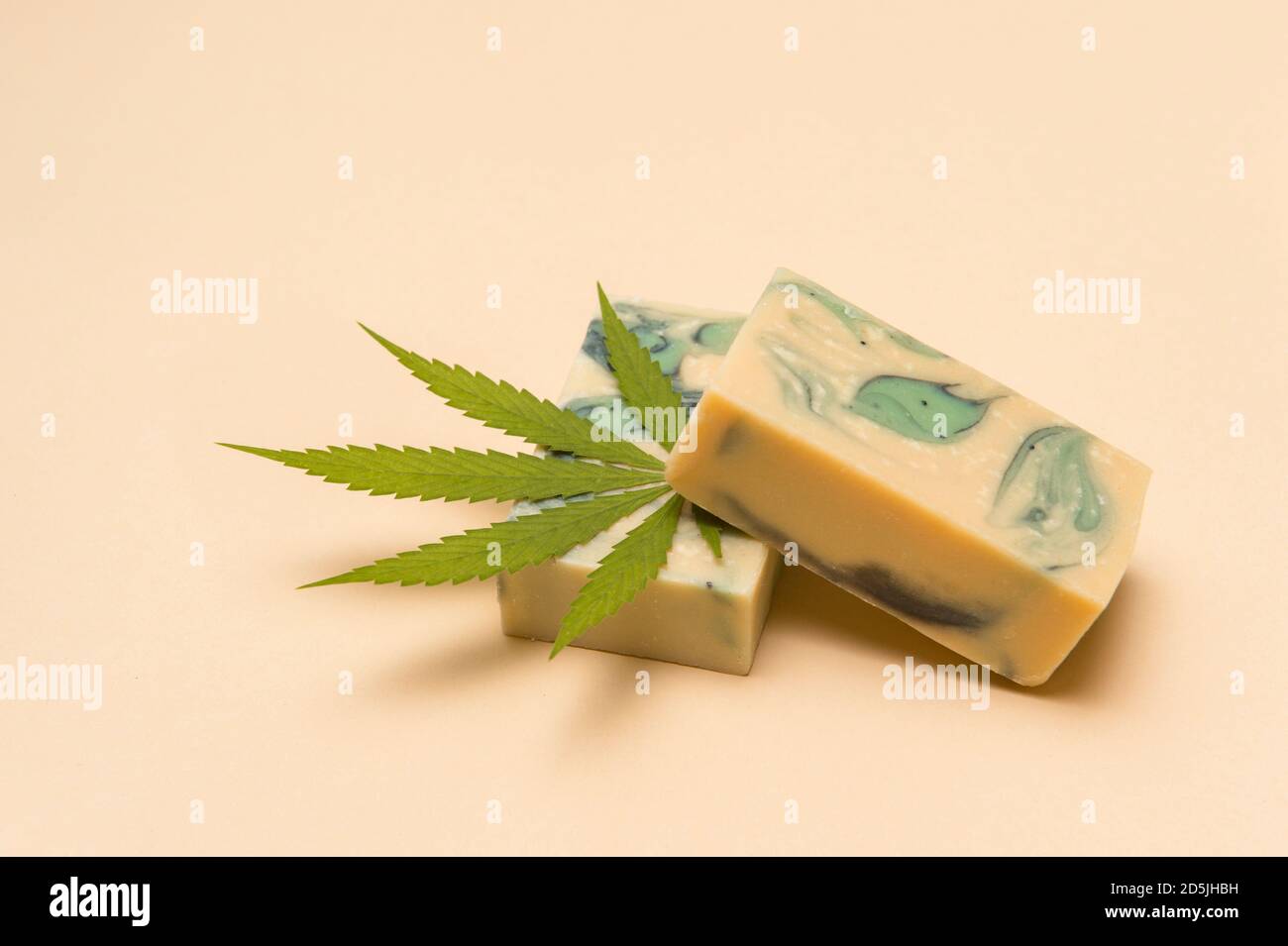 Homemade hemp soap and green leaf of marijuana. Spa organic soap ...