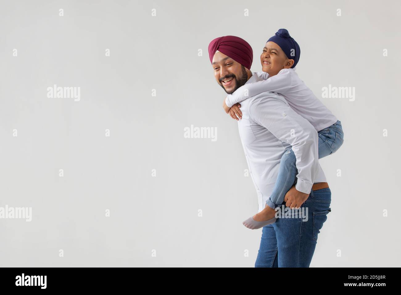 A SIKH FATHER SON LAUGHING AND PLAYING TOGETHER Stock Photo - Alamy