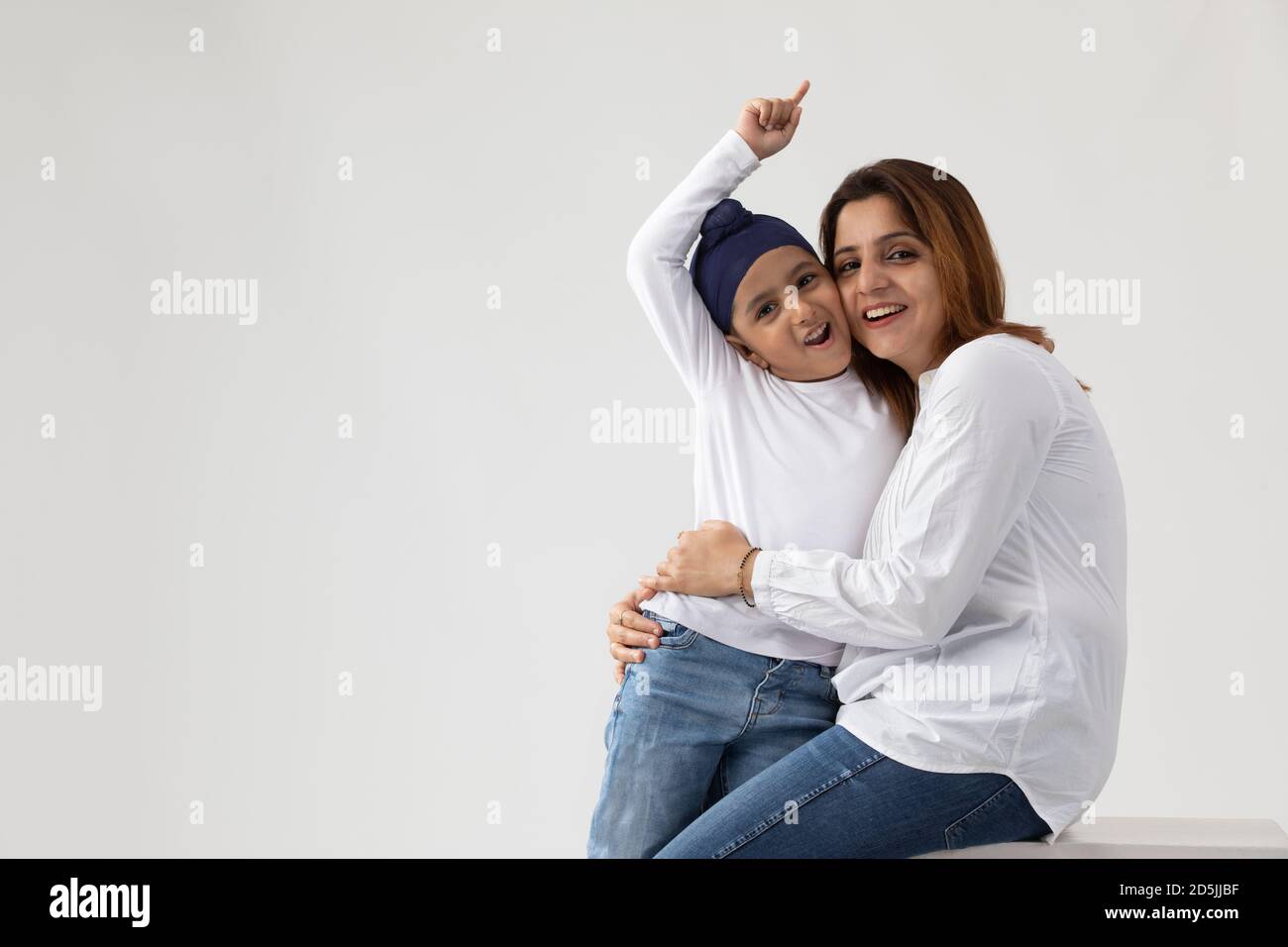 A SIKH MOTHER AND SON HAPPILY PLAYING AND SPENDING TIME TOGETHER Stock ...