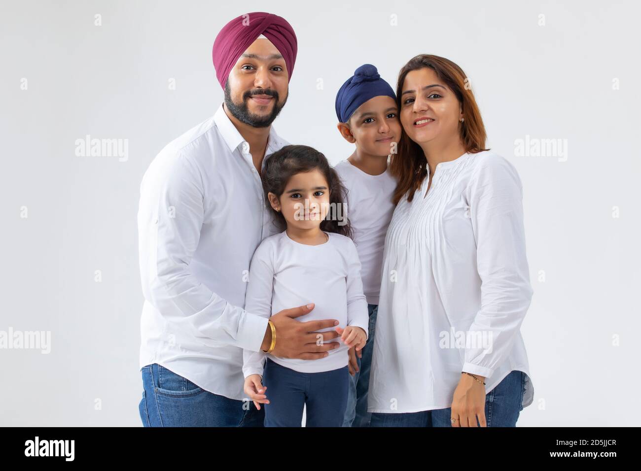 A SIKH FAMILY HAPPILY POSING TOGETHER Stock Photo - Alamy