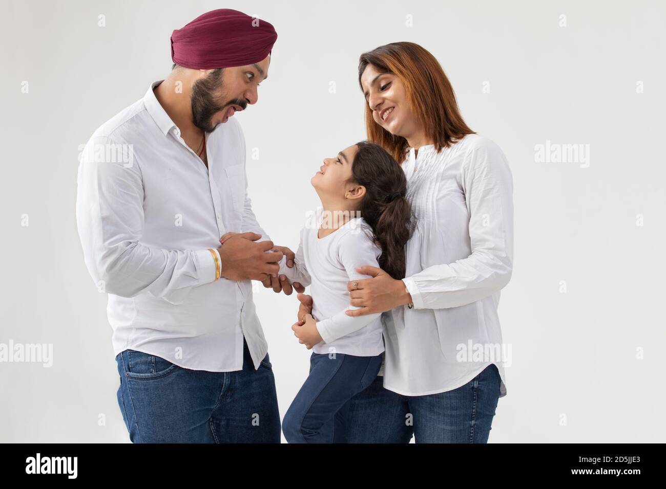 A SIKH FAMILY PLAYFULLY SPENDING TIME TOGETHER Stock Photo - Alamy