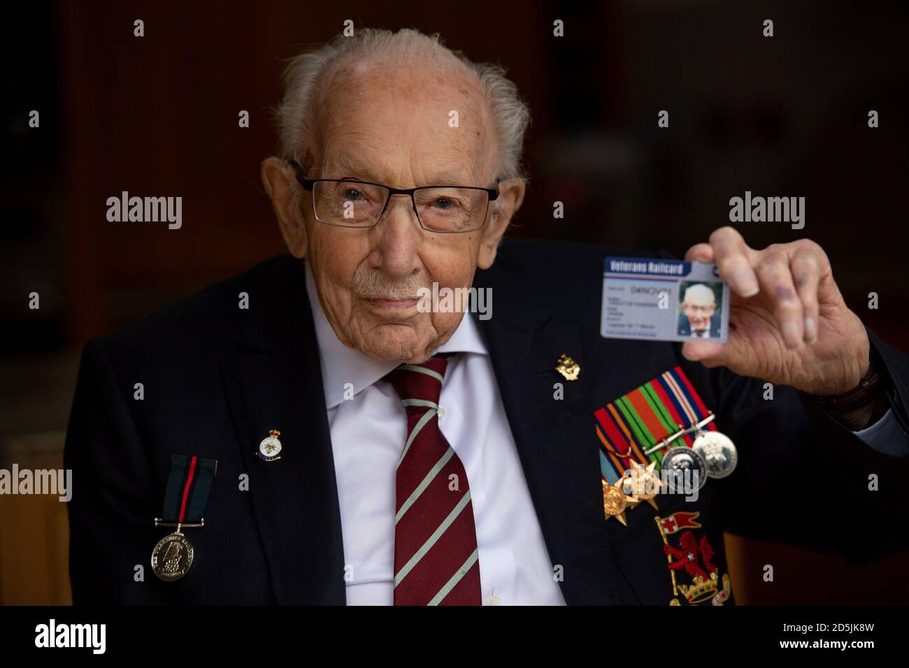 Captain Sir Tom Moore with the first veterans railcard in Marston ...