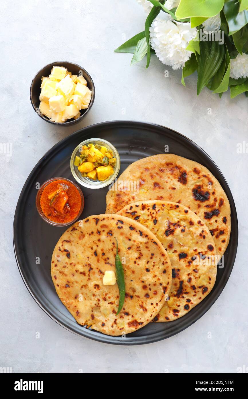 Aloo / Alu Paratha or Indian Potato stuffed Flatbread. Served with ...