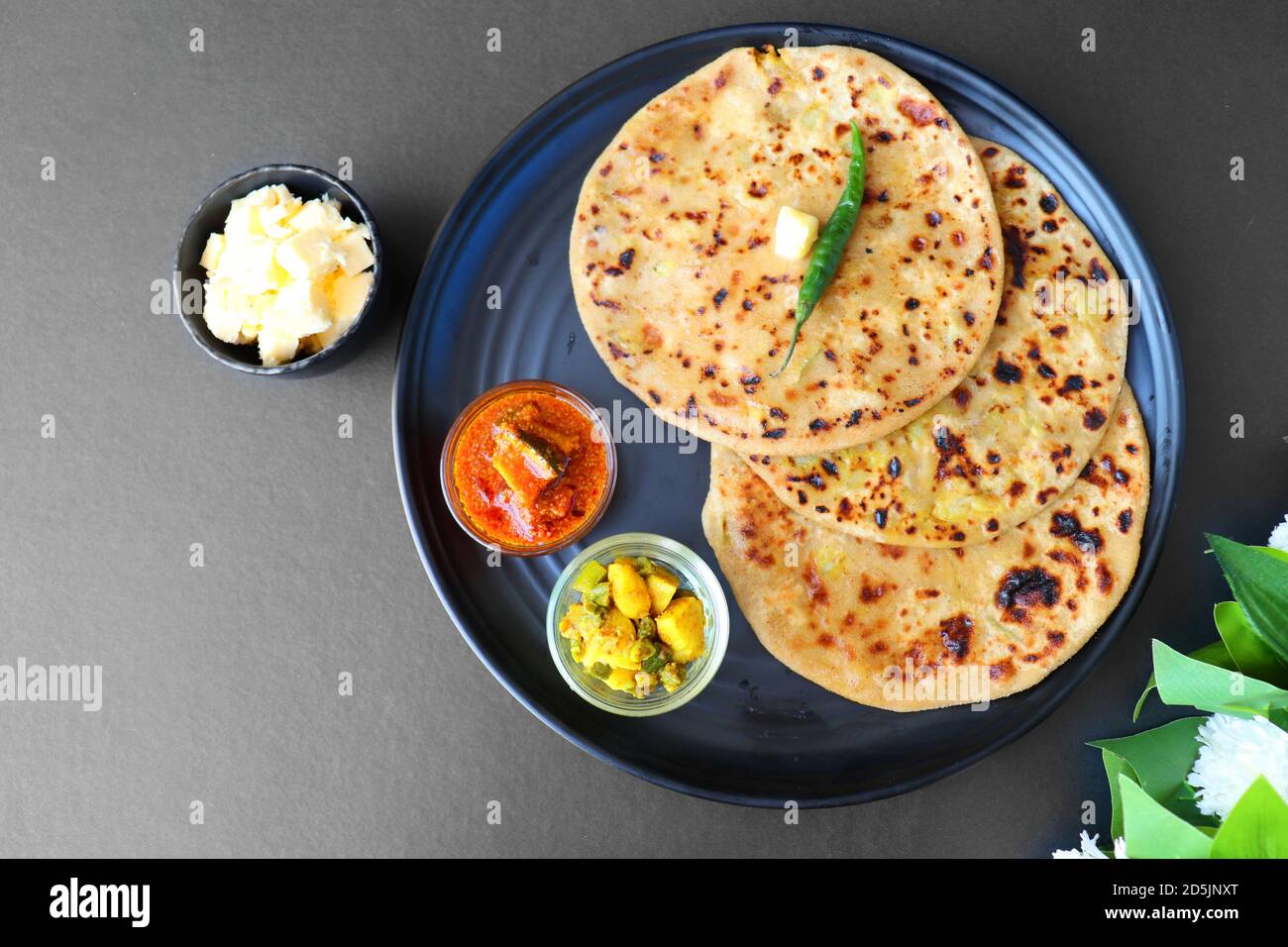 Aloo / Alu Paratha or Indian Potato stuffed Flatbread. Served with ...