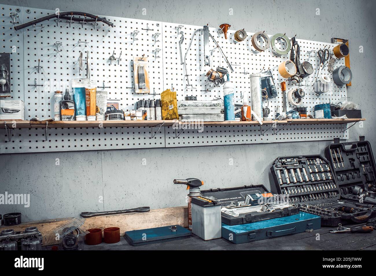 Moto workshop with hand mechanic tools kit. Workbench with sets of keys ...