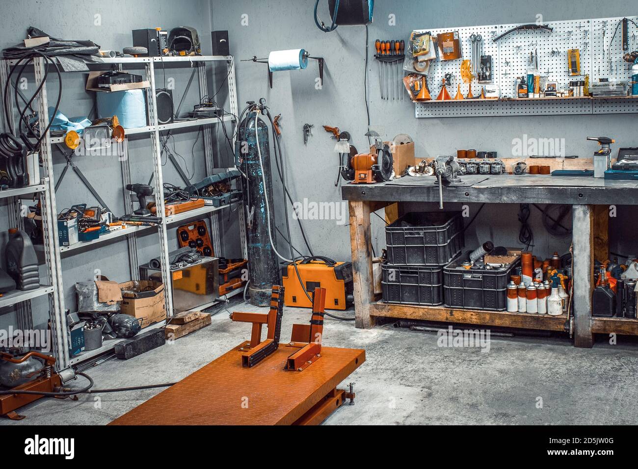 Garage, service area for disassembling, repairing motorcycles, car ...