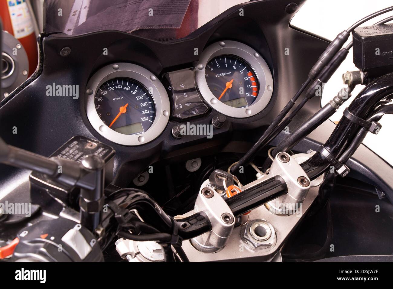 The arrow speedometer of a motorcycle on the steering wheel closeup ...